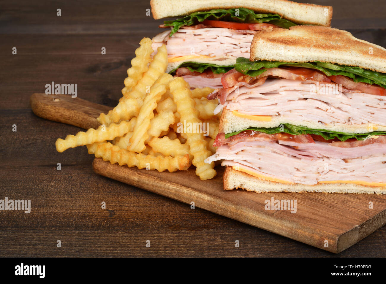 macro chicken club sandwich with fries Stock Photo - Alamy