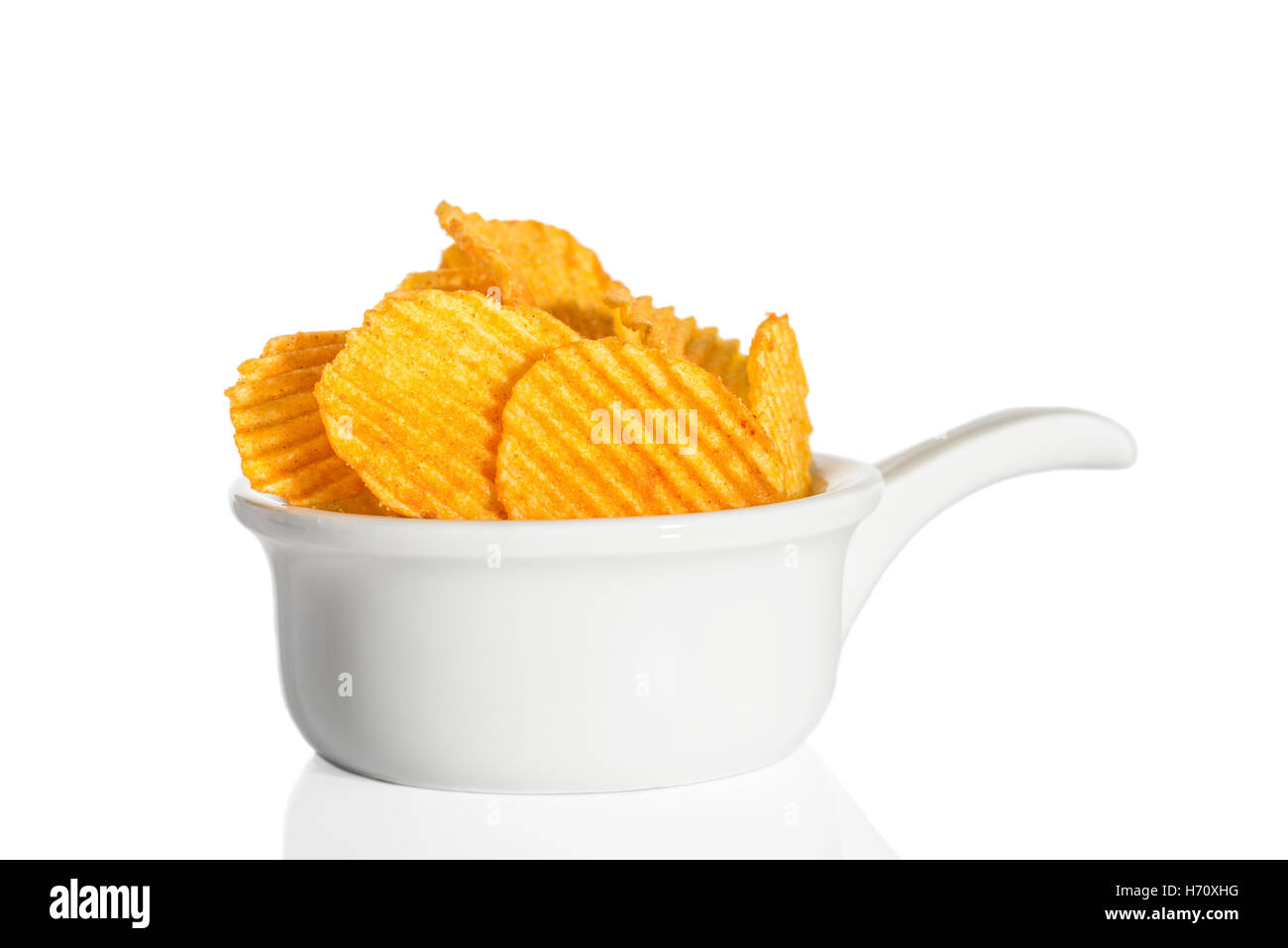 Crinkle cut crisps on a white background Stock Photo - Alamy