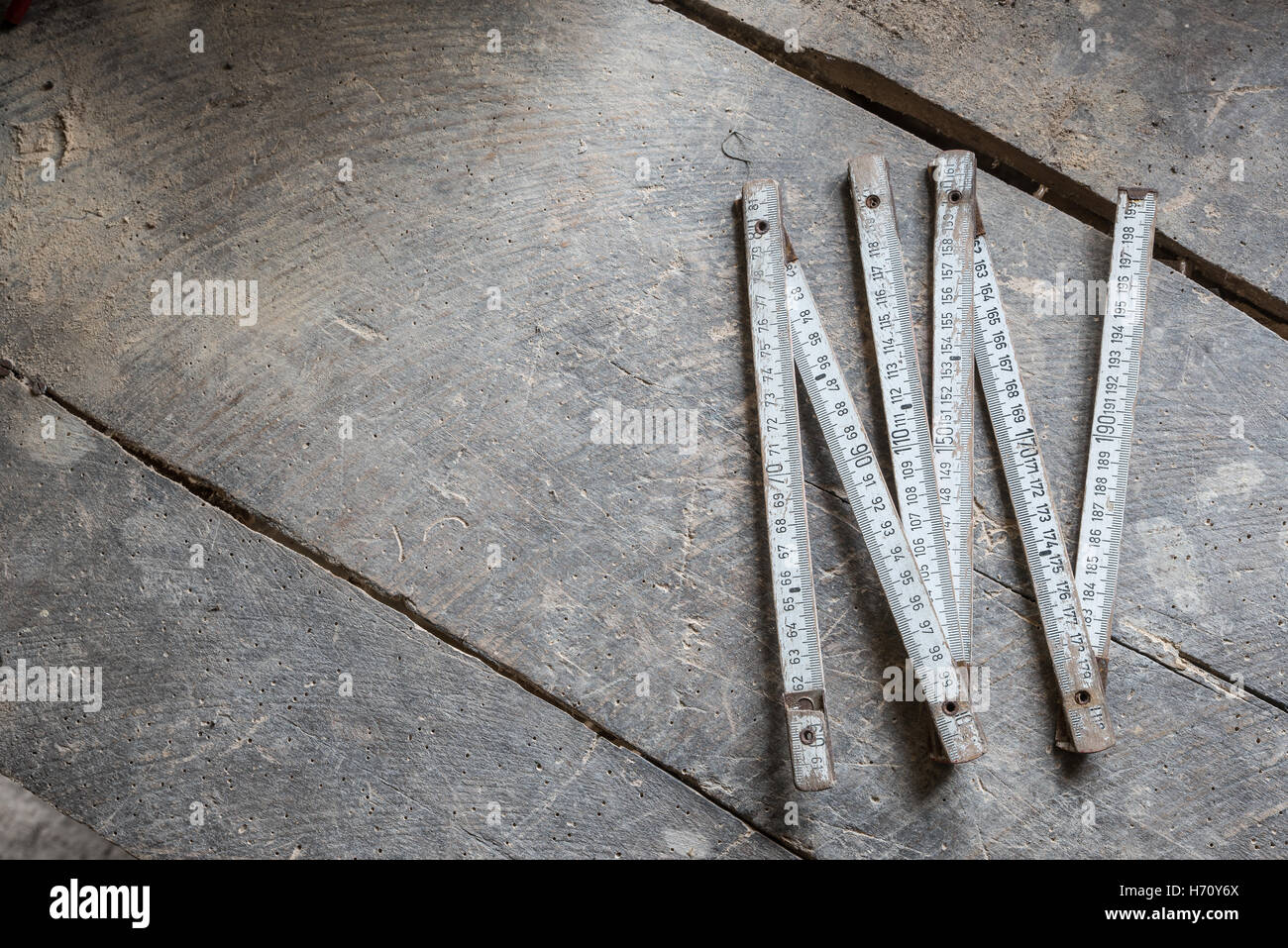Old measure on the workshop, wooden table Stock Photo - Alamy
