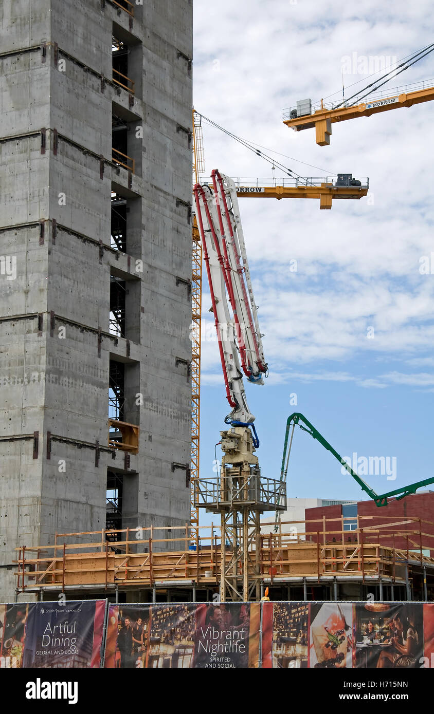 This is a vertical stock image of city construction of a high rise ...