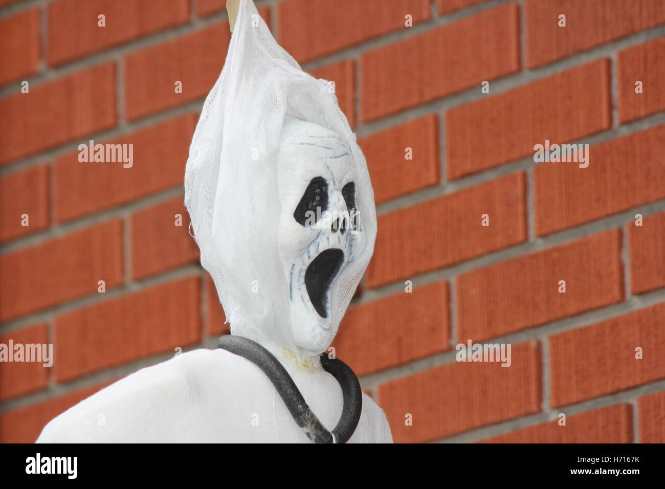 Halloween display of a white ghost hanging in the breeze outdoors Stock ...