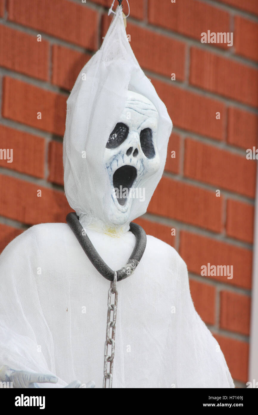 Halloween display of a white ghost hanging in the breeze outdoors Stock ...