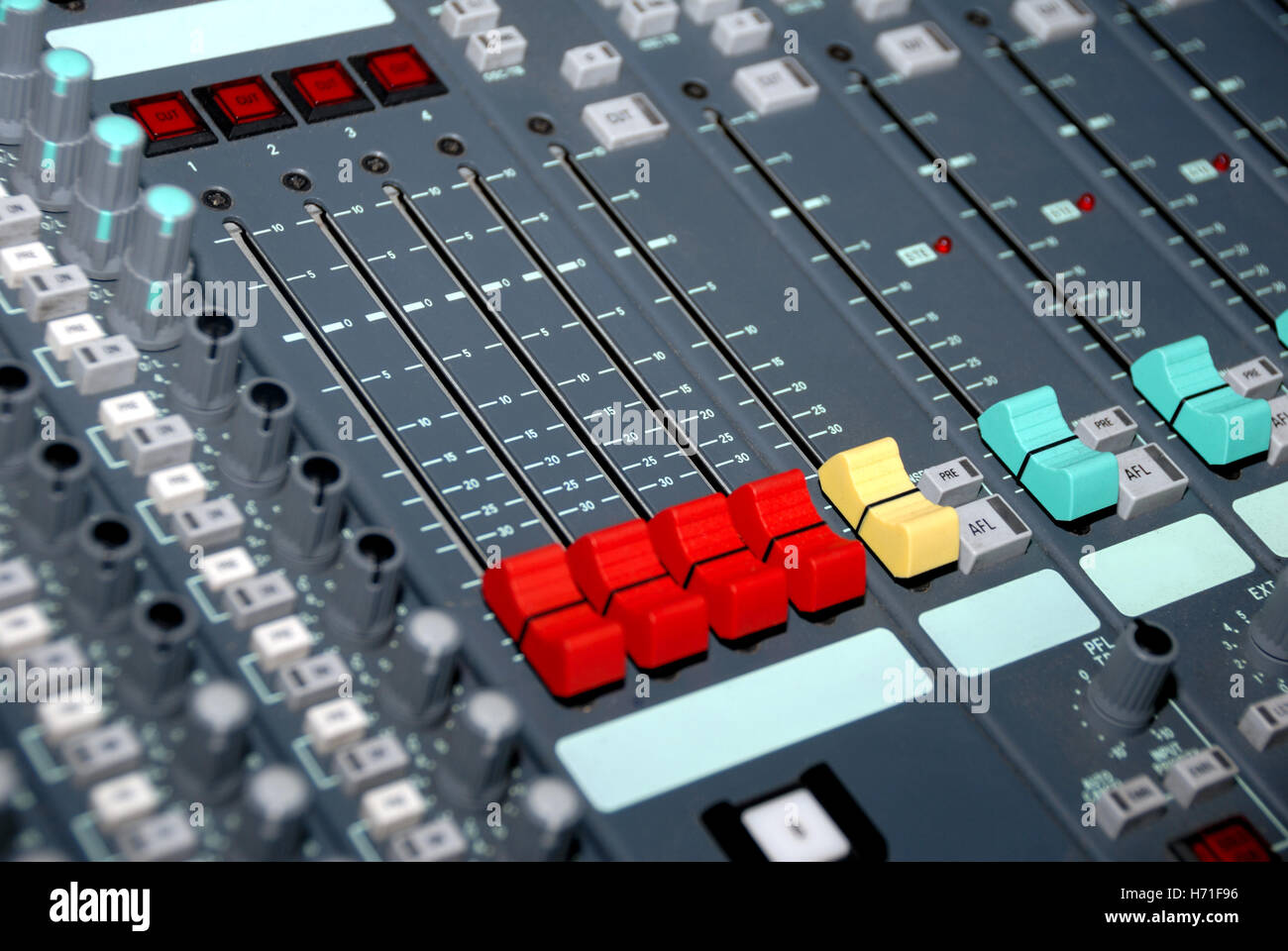 Audio mixing console in a recording studio. Faders and knobs of a sound ...
