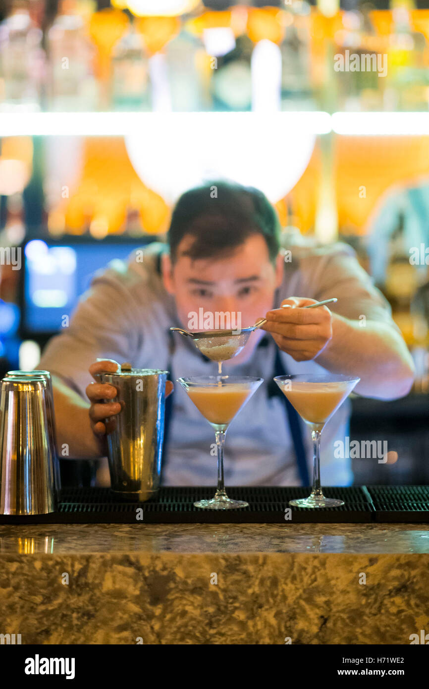 A man makes cocktails at a bar Stock Photo - Alamy
