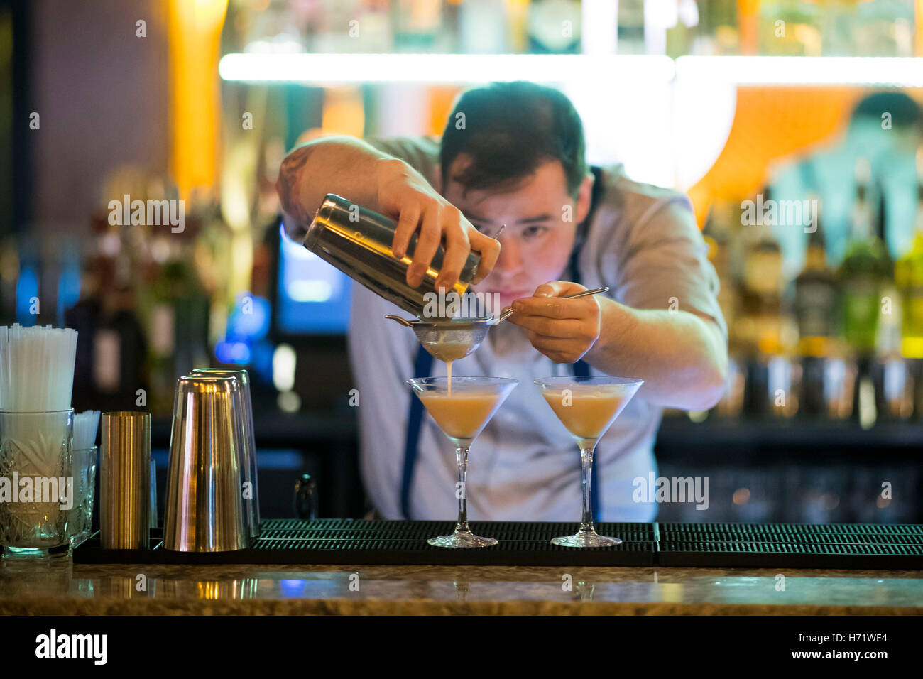 A man makes cocktails at a bar Stock Photo - Alamy