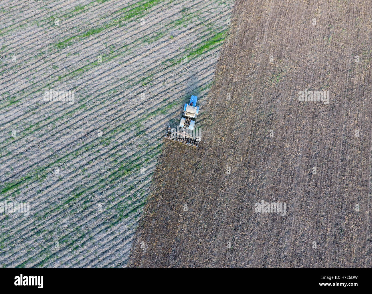 Top view of the tractor that plows the field. disking the soil. Soil ...