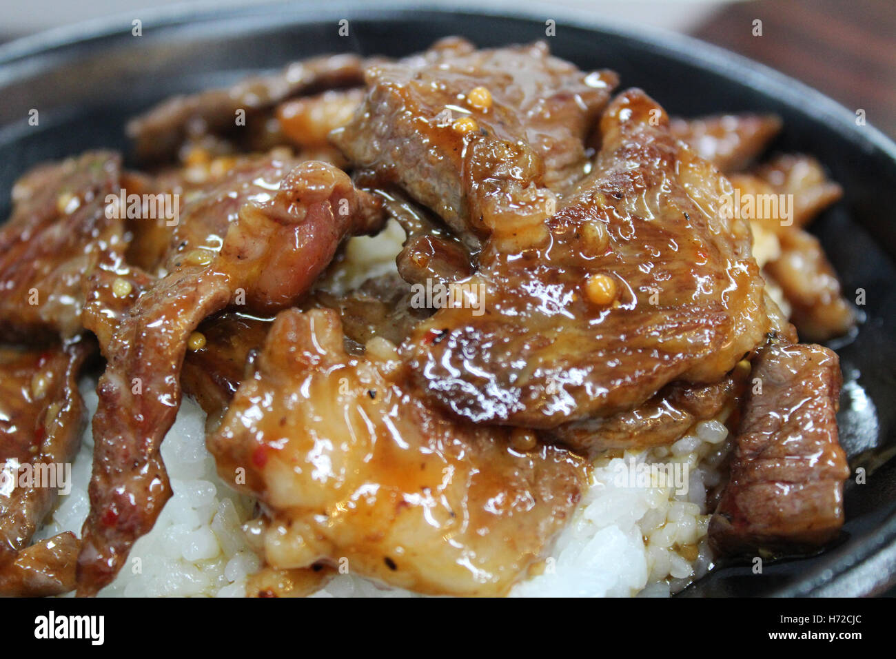 Wagyu beef with rice in the Kuromon Ichiba Market, Osaka, Japan Stock ...