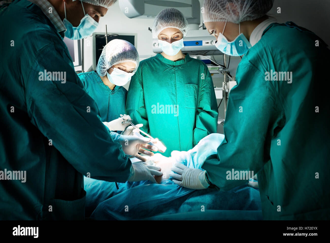 Surgeons team during a surgery Stock Photo - Alamy