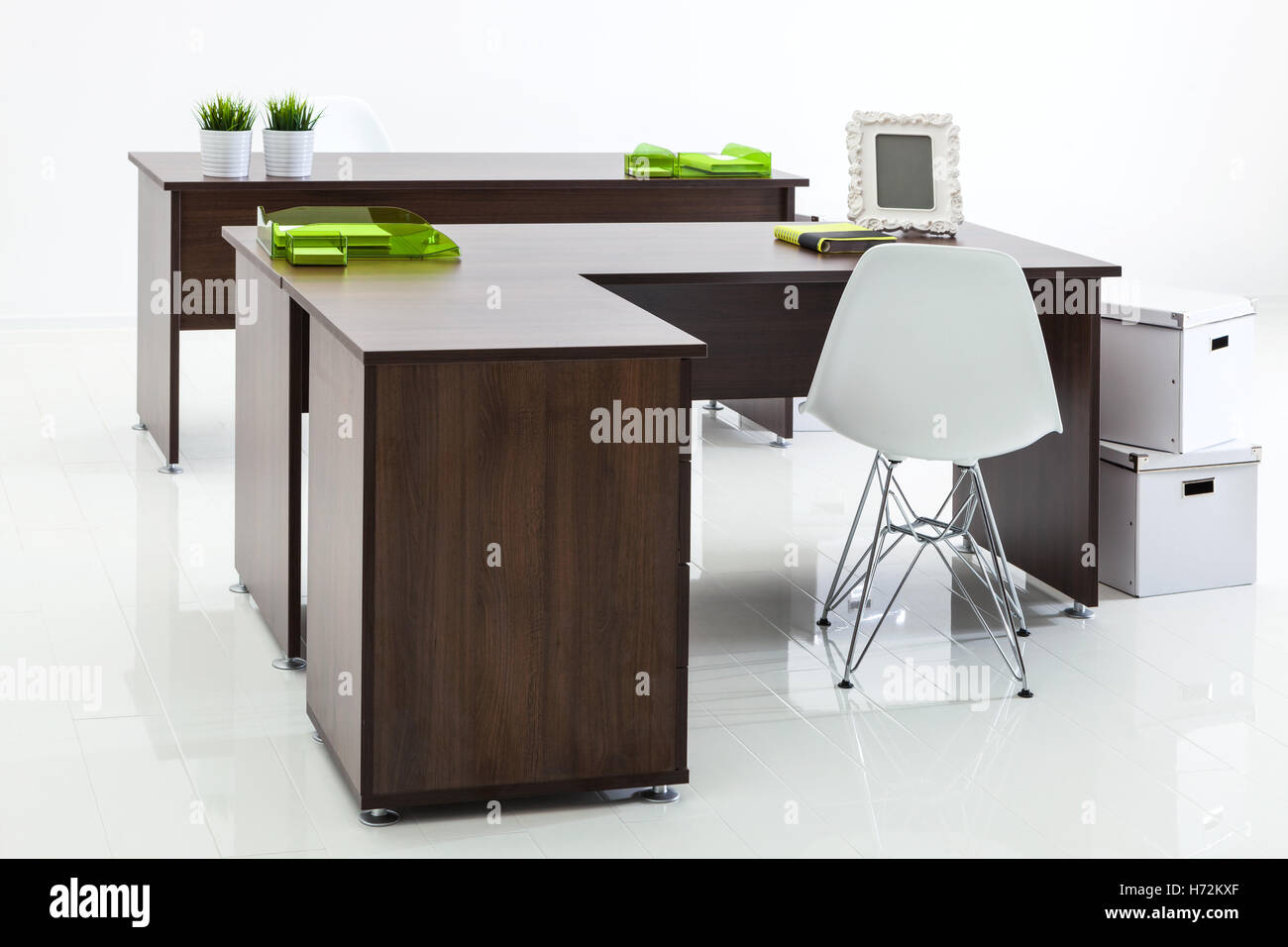 desks and armchairs with reflection on white background Stock Photo - Alamy