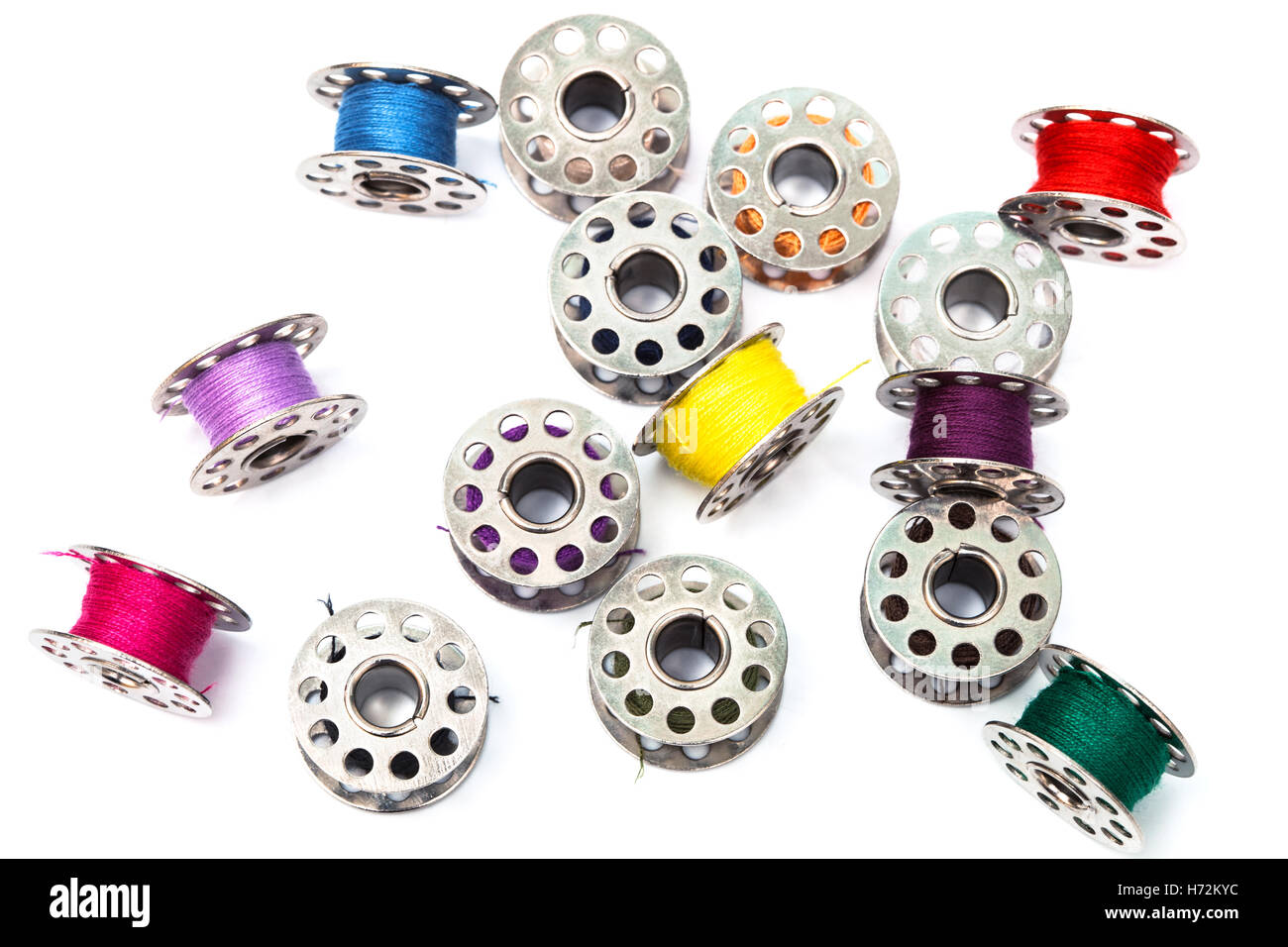 spools of thread on a white background Stock Photo - Alamy