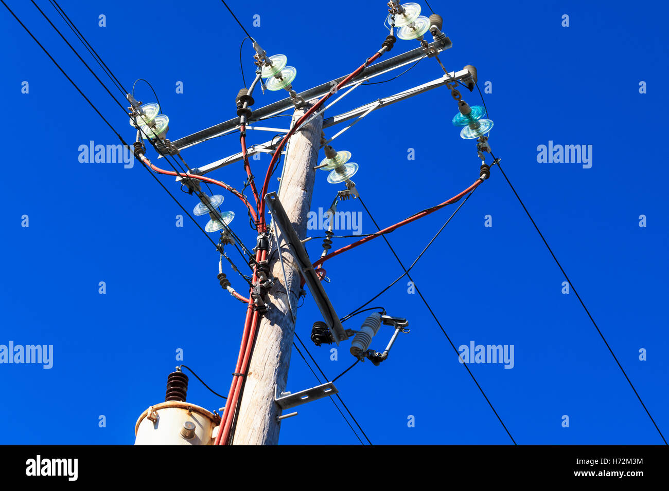 post with electrical wires in the sky Stock Photo - Alamy