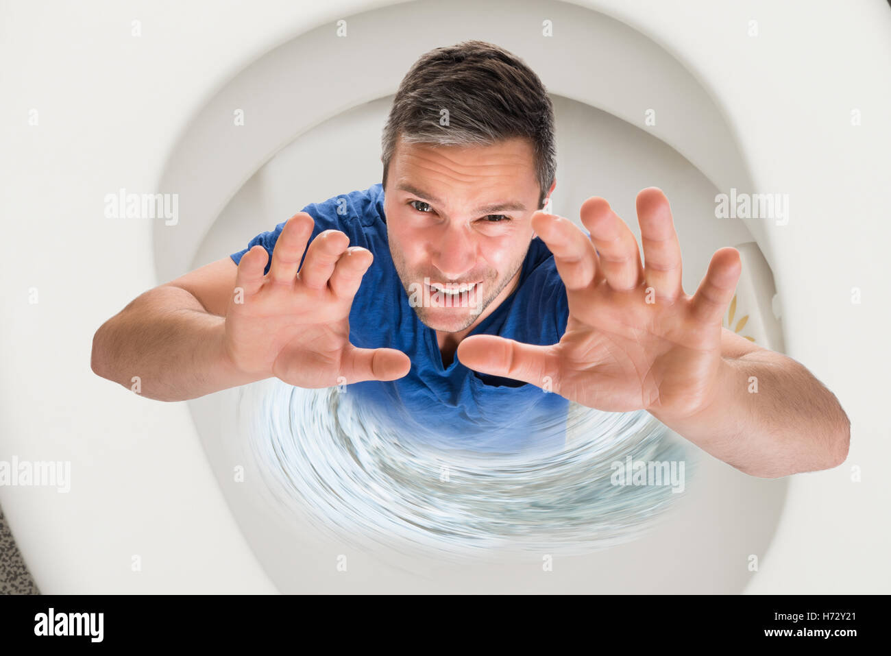 Man flushed toilet hi-res stock photography and images - Alamy