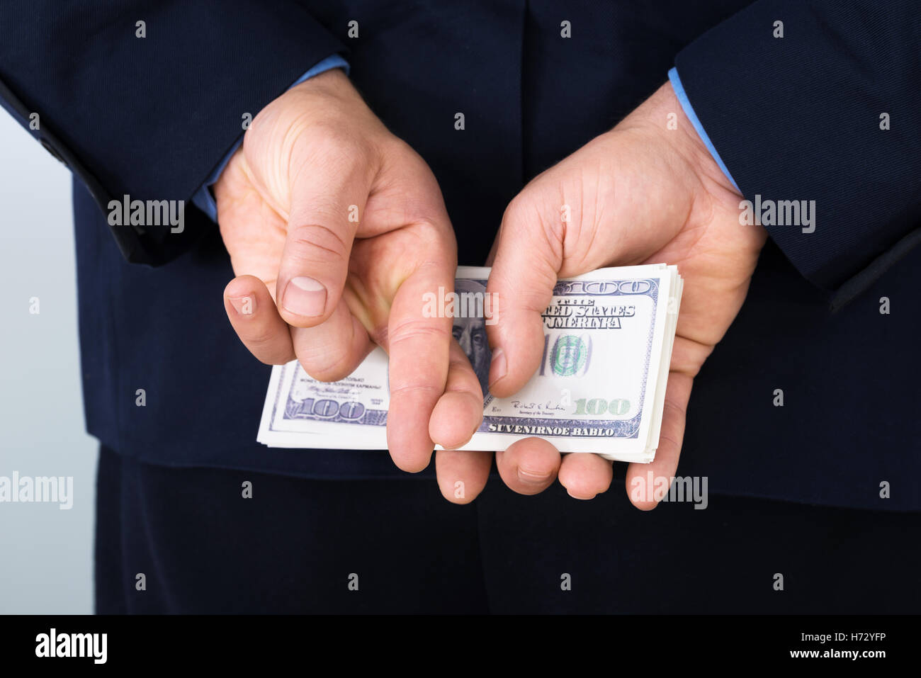 Hide money behind back hi-res stock photography and images - Alamy