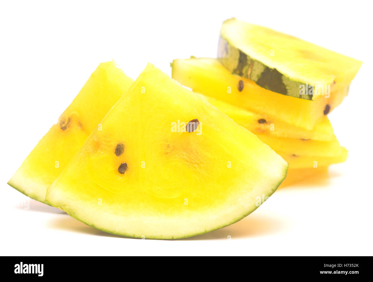 yellow watermelon slices isolated on white background Stock Photo - Alamy