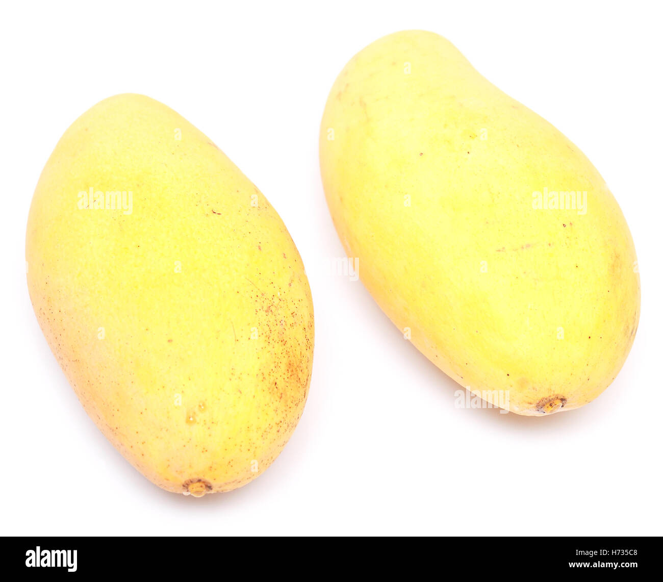 ripe mangoes isolated on white background Stock Photo - Alamy