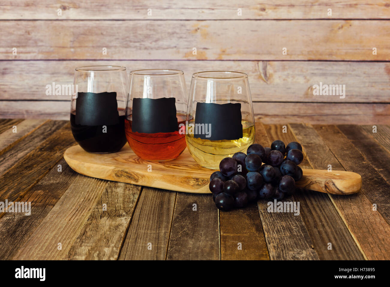 Three color wine flight in chalkboard label glasses Stock Photo - Alamy