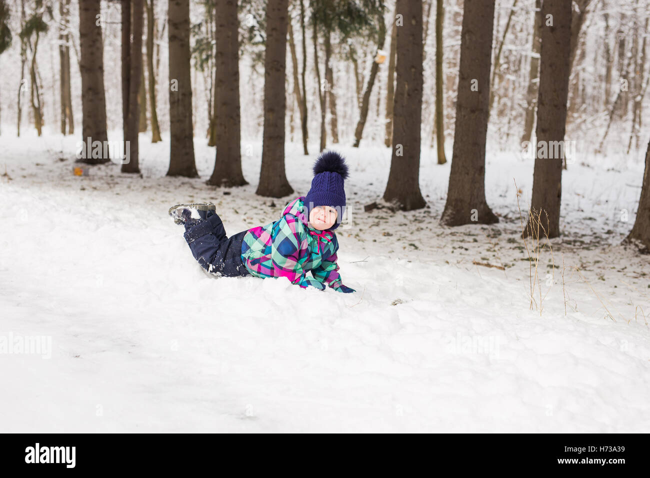 Happy little kid is playing in snow, good winter weather Stock Photo ...