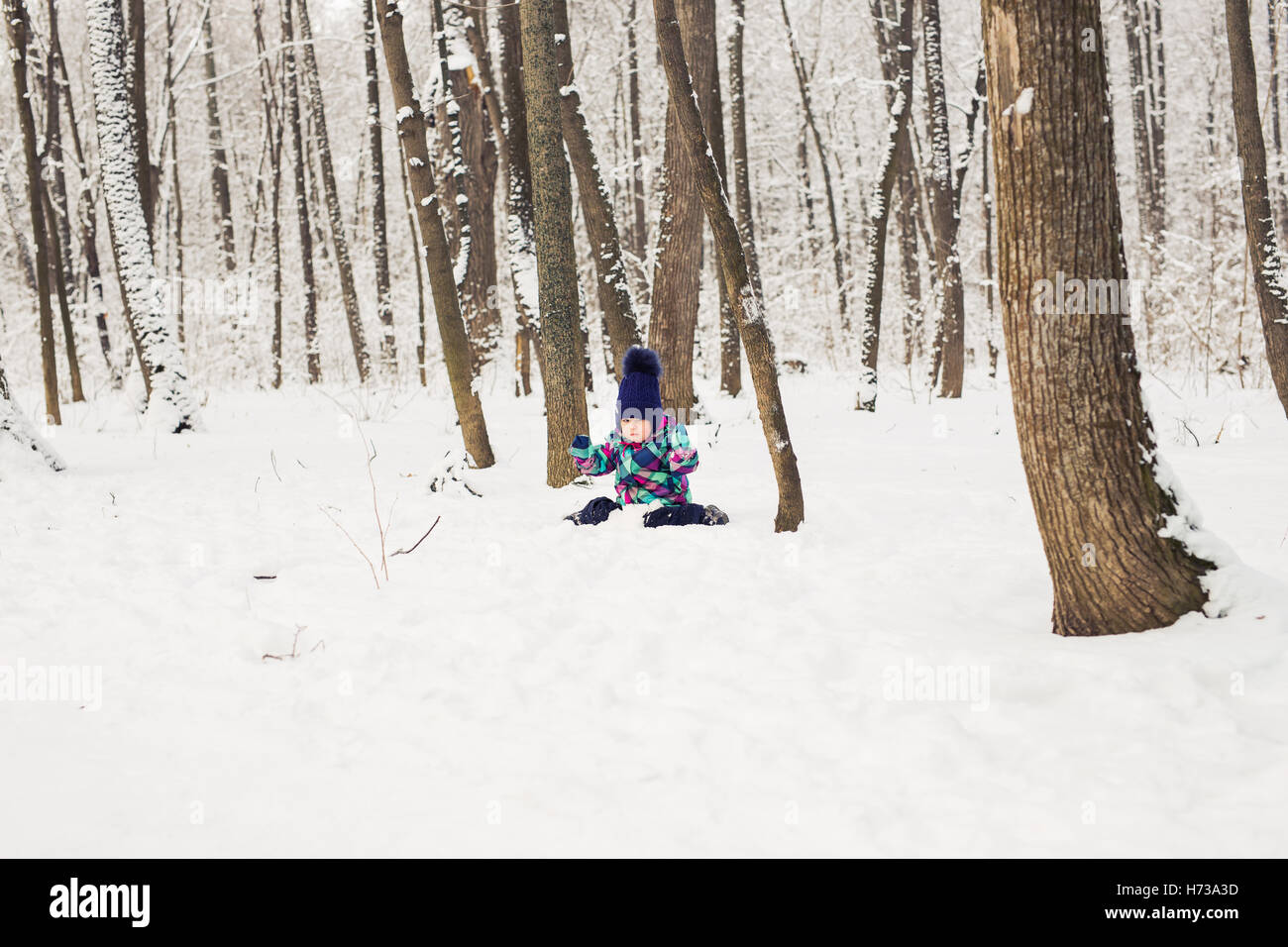 Happy little kid is playing in snow, good winter weather Stock Photo ...