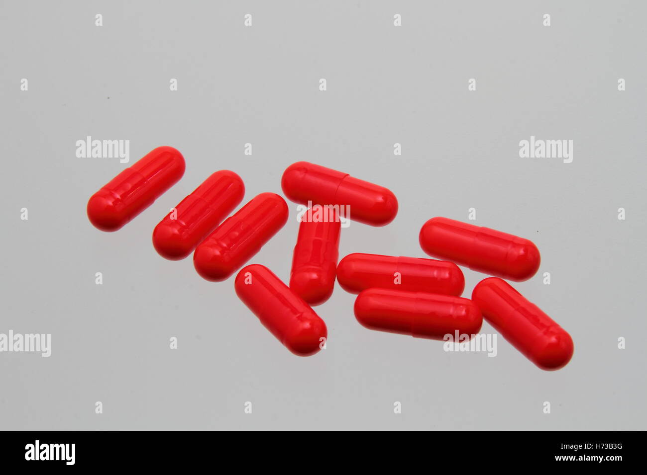 Red capsules isolated on a white background image with copy space Stock ...