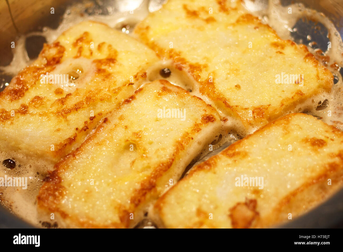 French toast frying in butter in a pan Stock Photo - Alamy