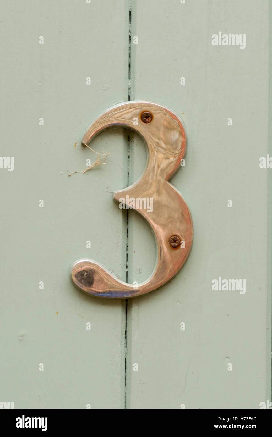 House Number 3 sign on gate Stock Photo - Alamy