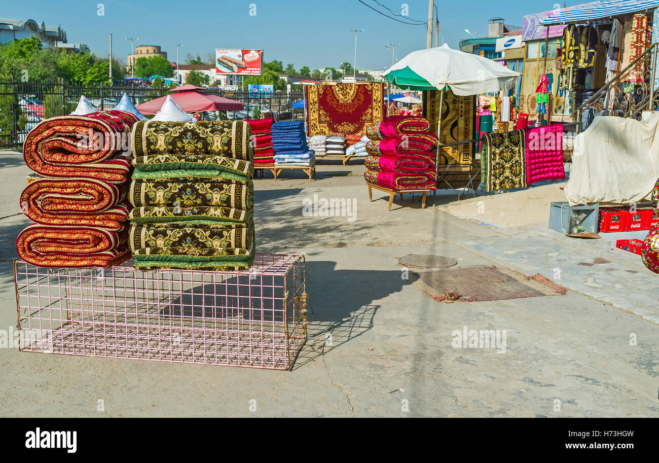 The rug stalls in Chorsu Bazaar with many traditional local goods Stock ...