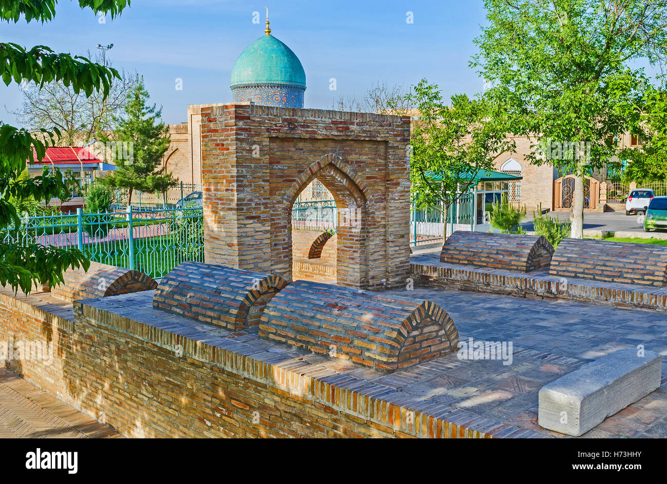 The brick gate of Kaffal Shashi Mausoleum with the old tombs on both ...