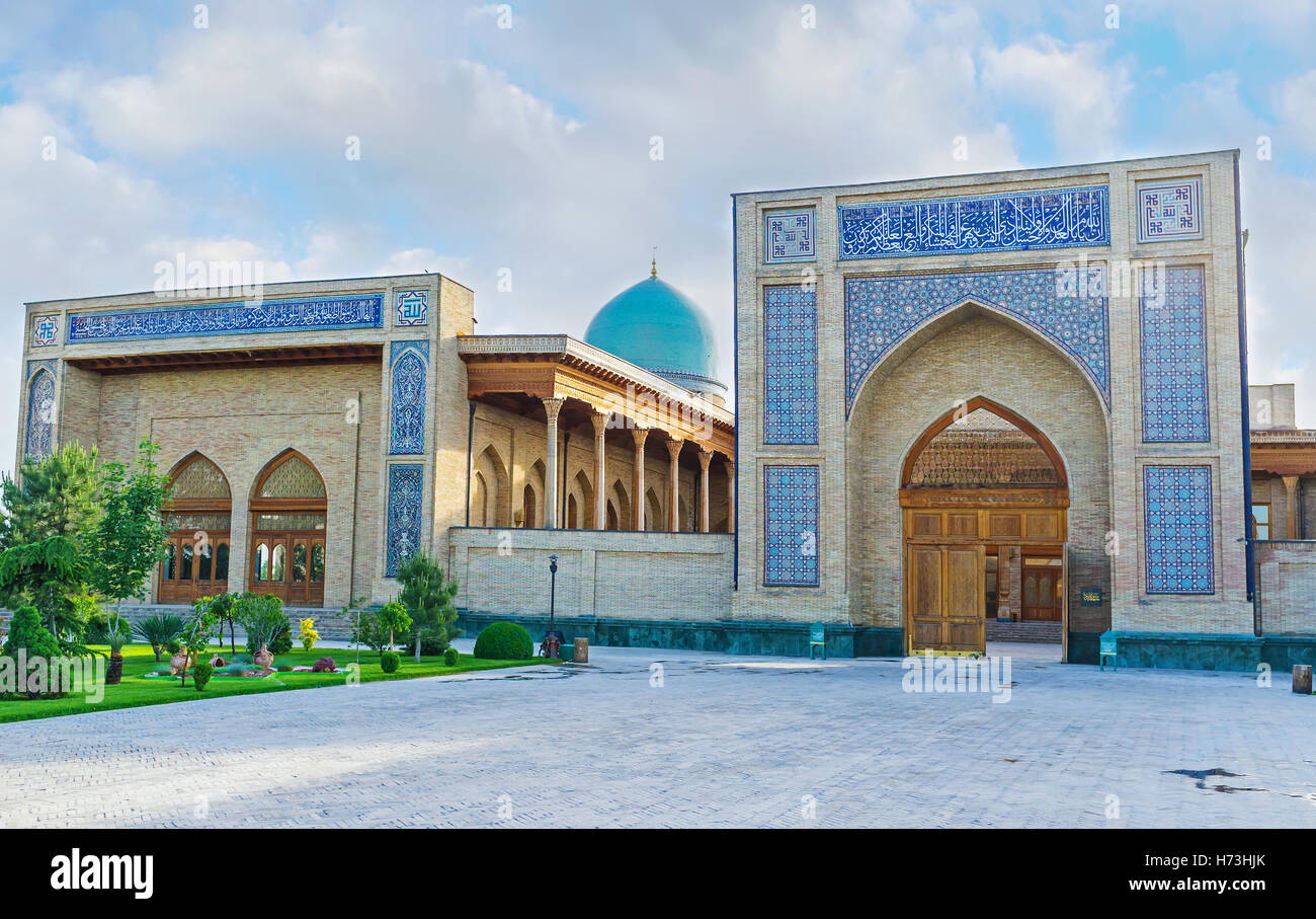 The huge portal, decorated with arabic calligraphy and islamic patterns ...