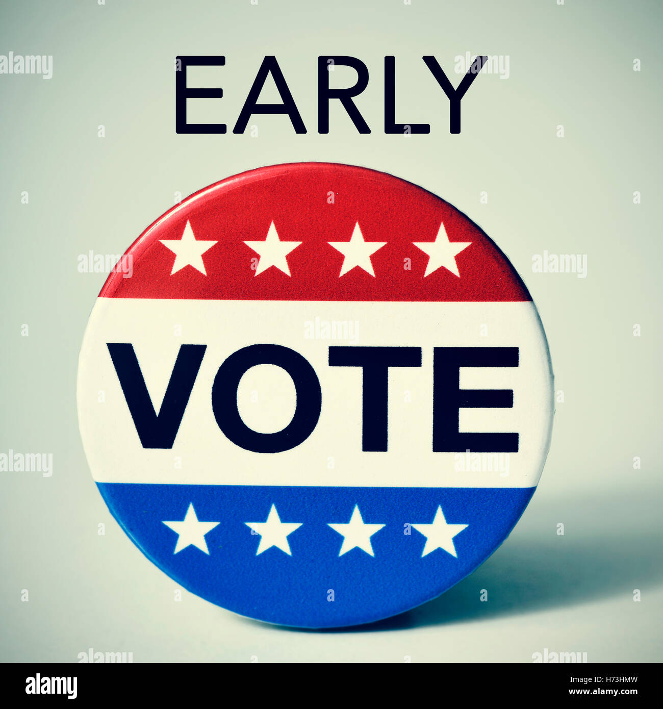 closeup of a badge with the word vote written in it, and the word early ...