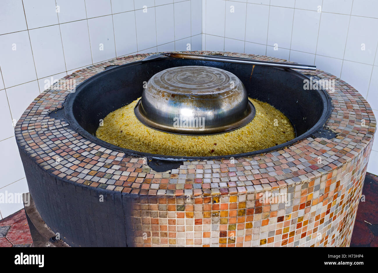 The process of preparing pilaf in kitchen of Centeral Asian Pilaf ...