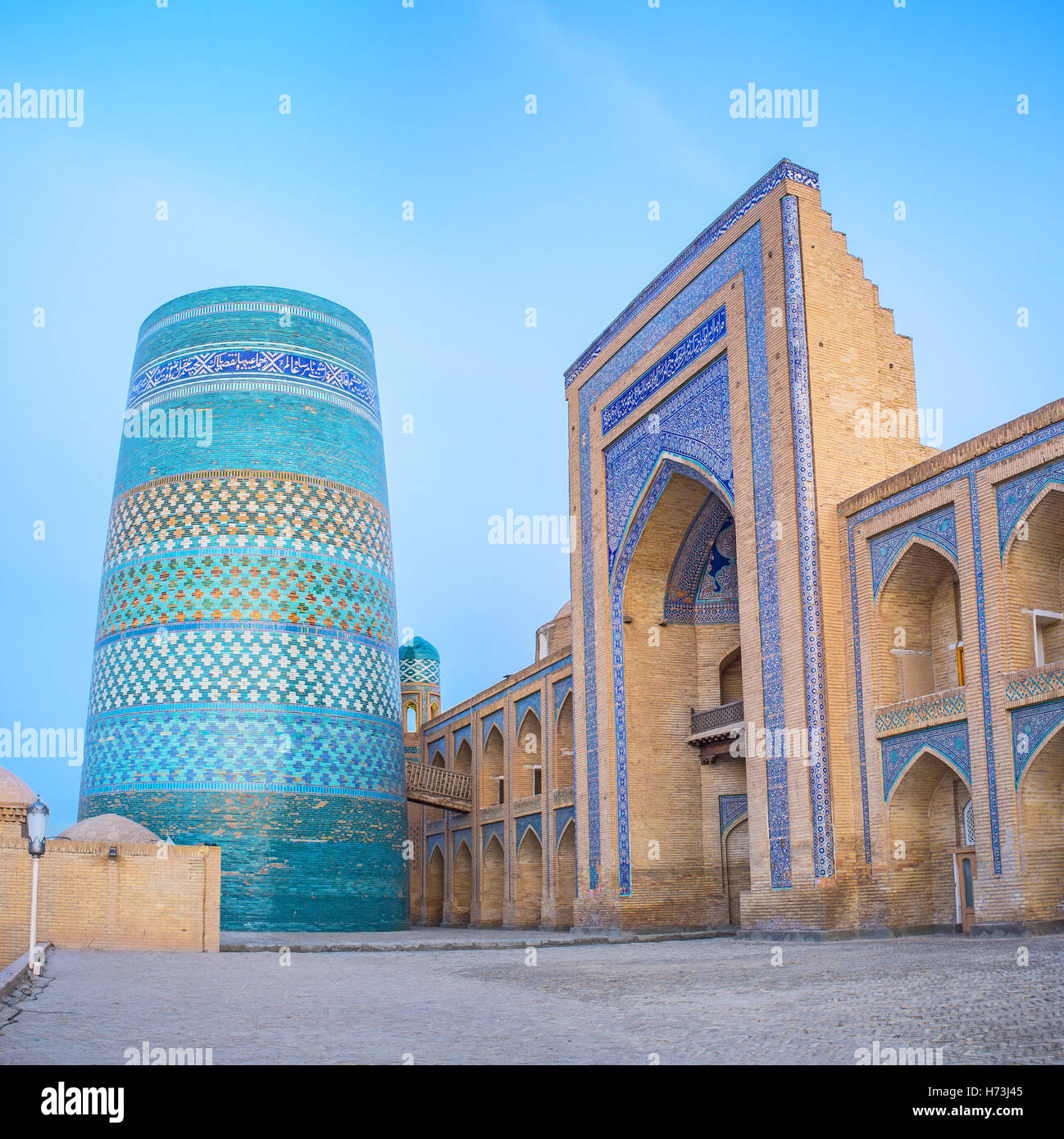 The unique and unfinished Kalta Minor Minaret, covered with bright blue ...