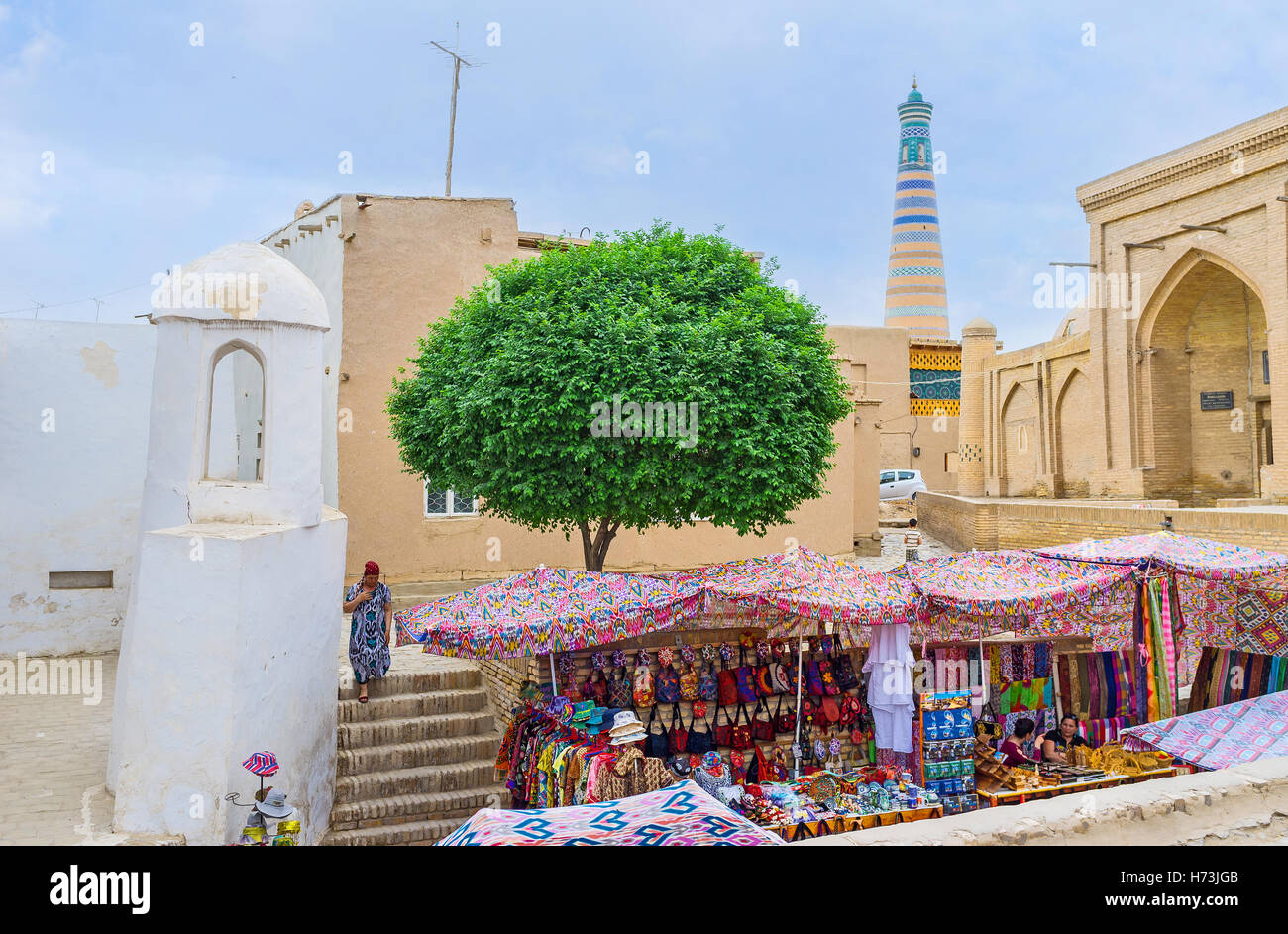 The colorful stalls of the local bazaar on the narrow street next to ...