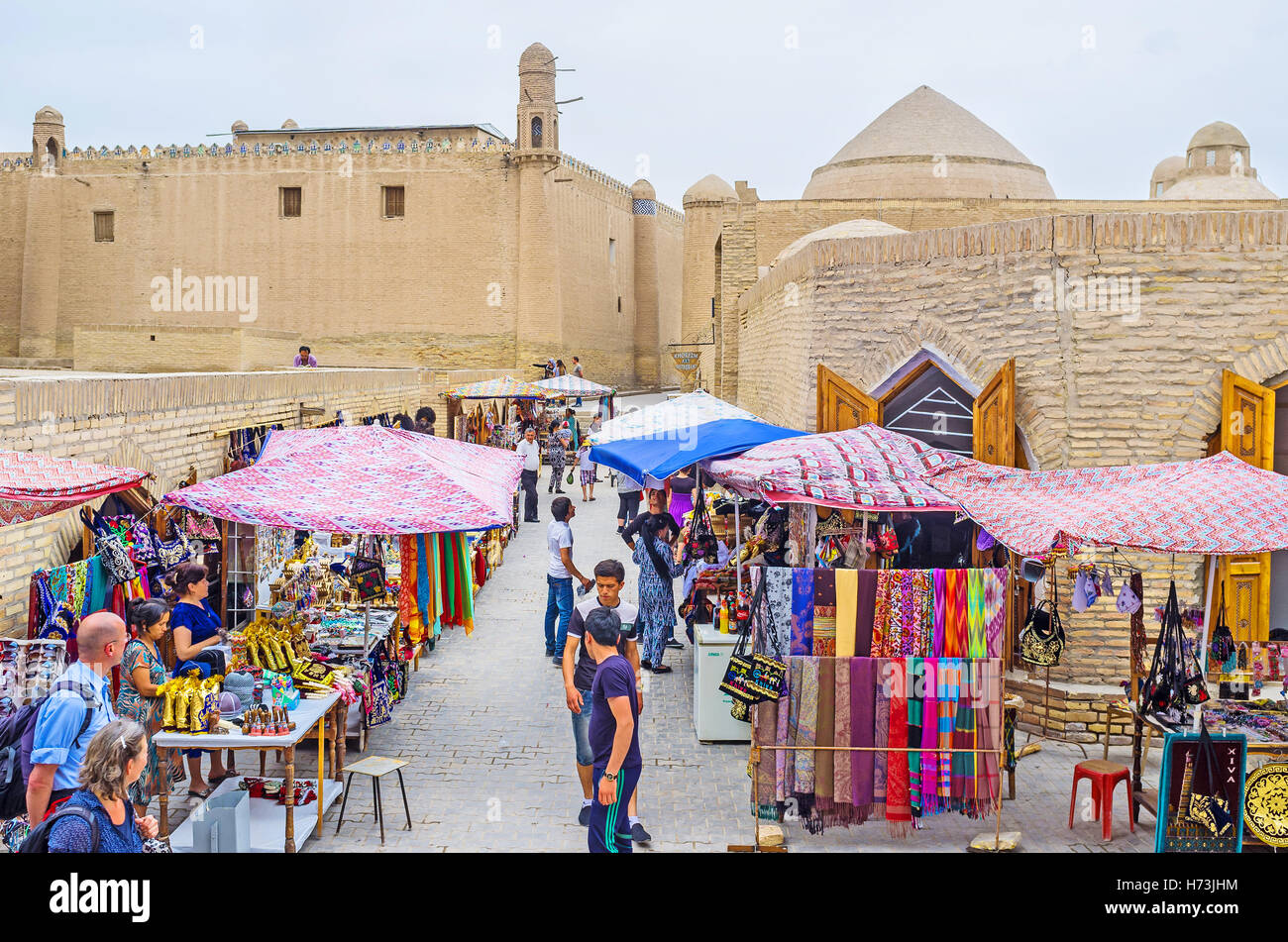 The tourists and locals enjoy the traditional asian bazaar in the narrow street next to Allakuli ...