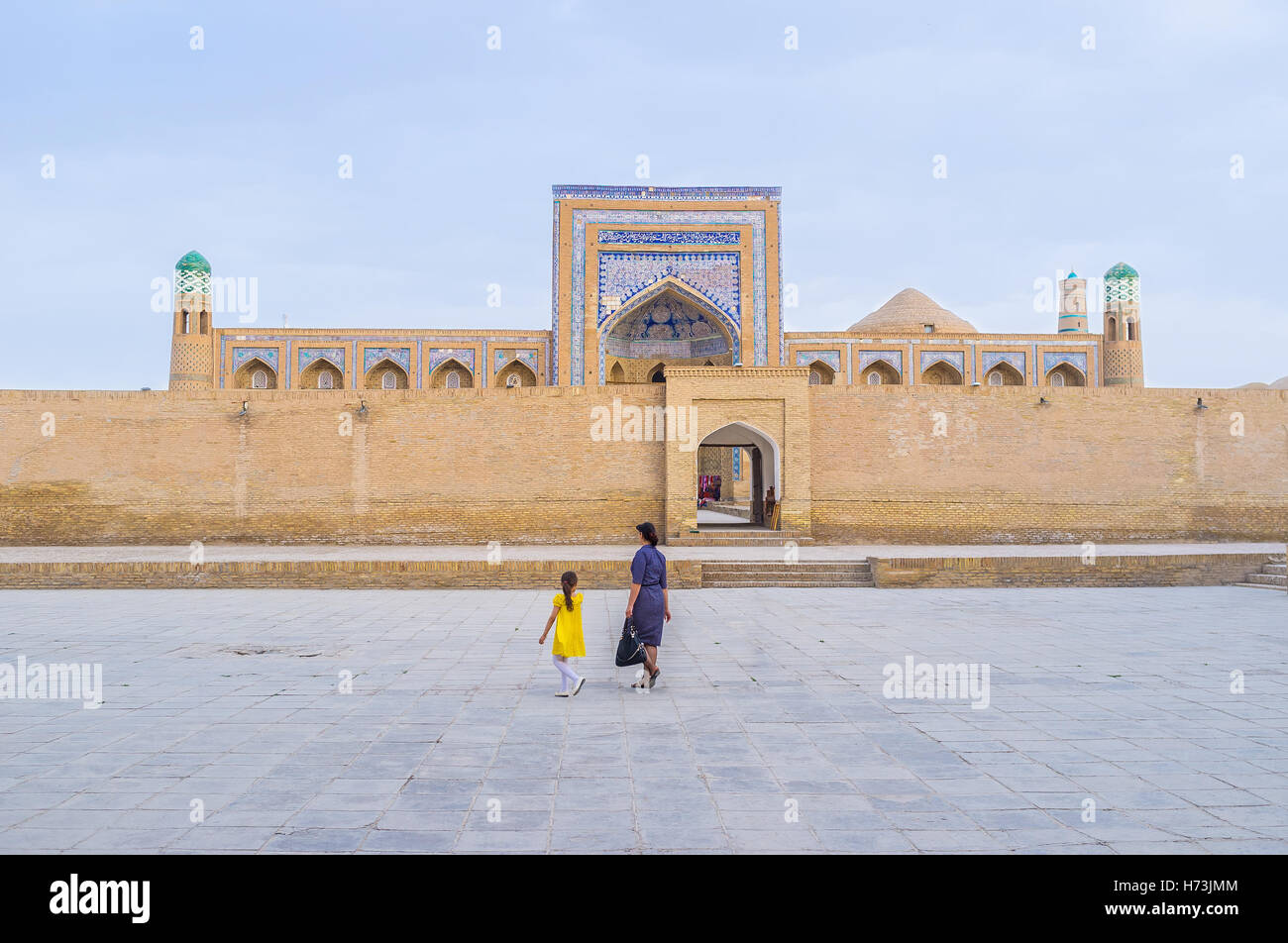 The Muhammad Rahim-khan Madrasah behind the high brick wall, Khiva ...