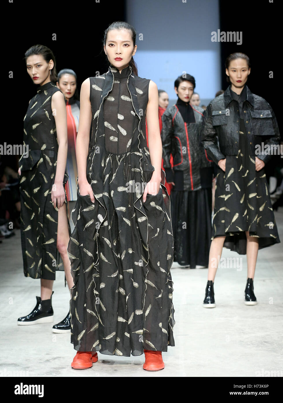 Beijing, China. 1st Nov, 2016. Models present creations by designer ...