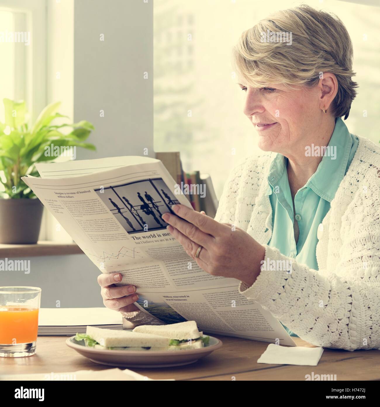 Senior Adult Reading Newspaper Concept Stock Photo - Alamy