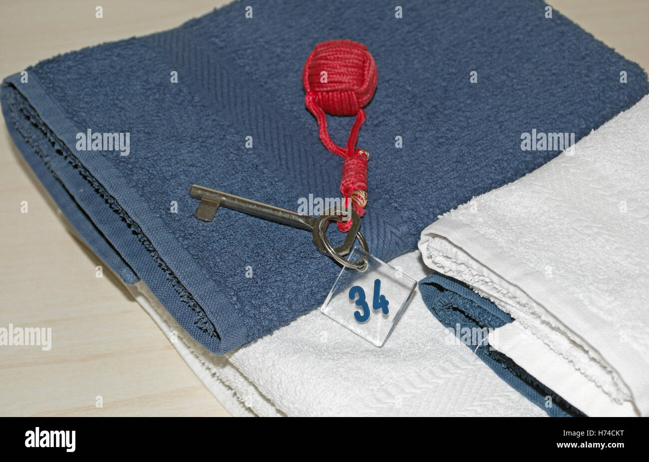 hotel key and towels Stock Photo - Alamy