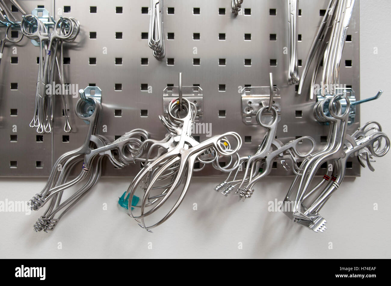 Surgical tools organized on a rack, waiting to be sterilised for ...