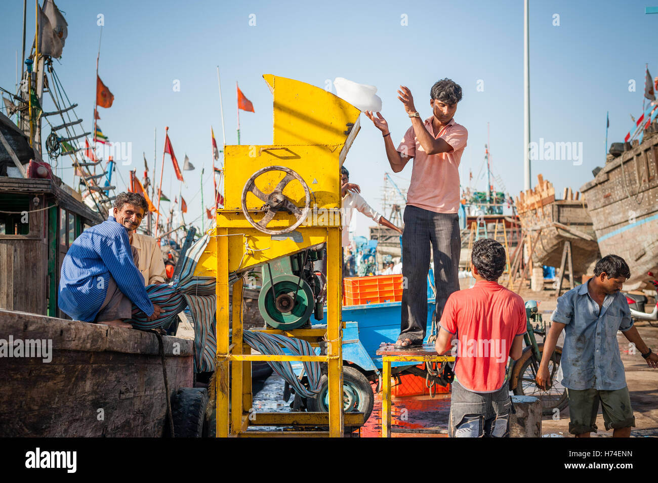 Grinding ice block for fishing Stock Photo - Alamy