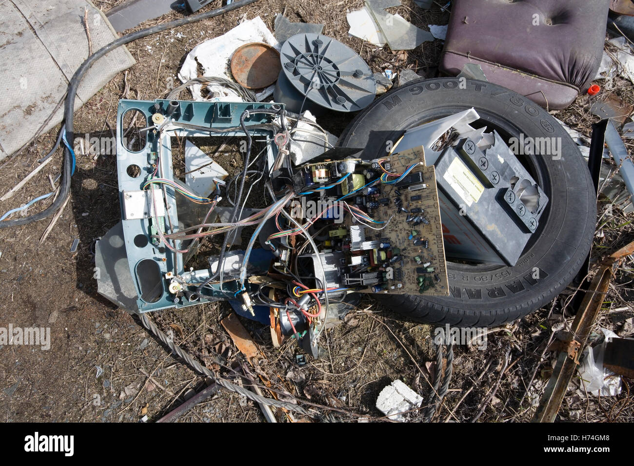 dumped electronics and car parts Stock Photo - Alamy