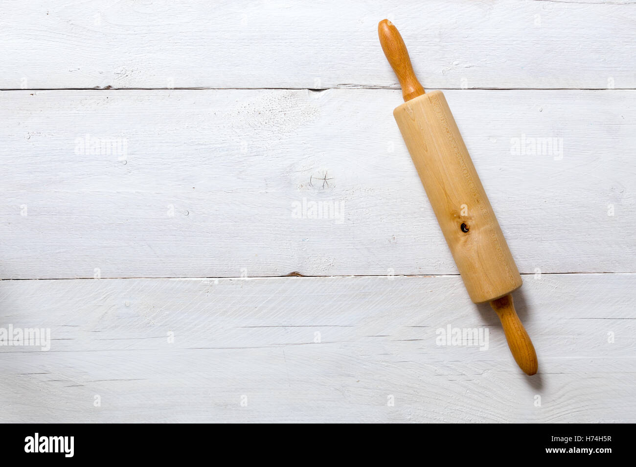 rolling pin on a rustic light wood background Stock Photo - Alamy