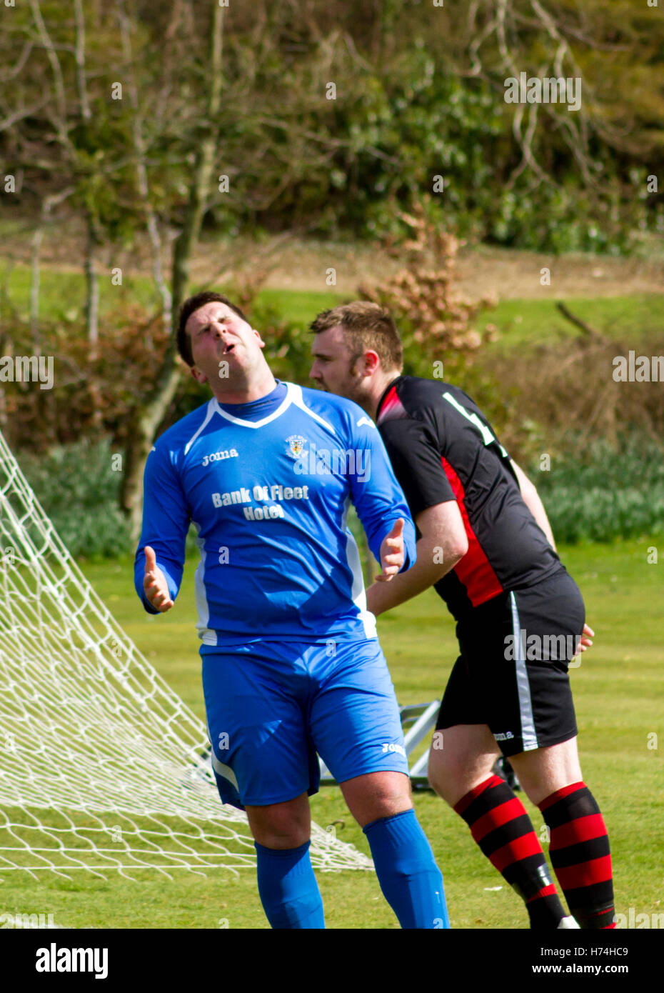 Footballers tackle hi-res stock photography and images - Alamy