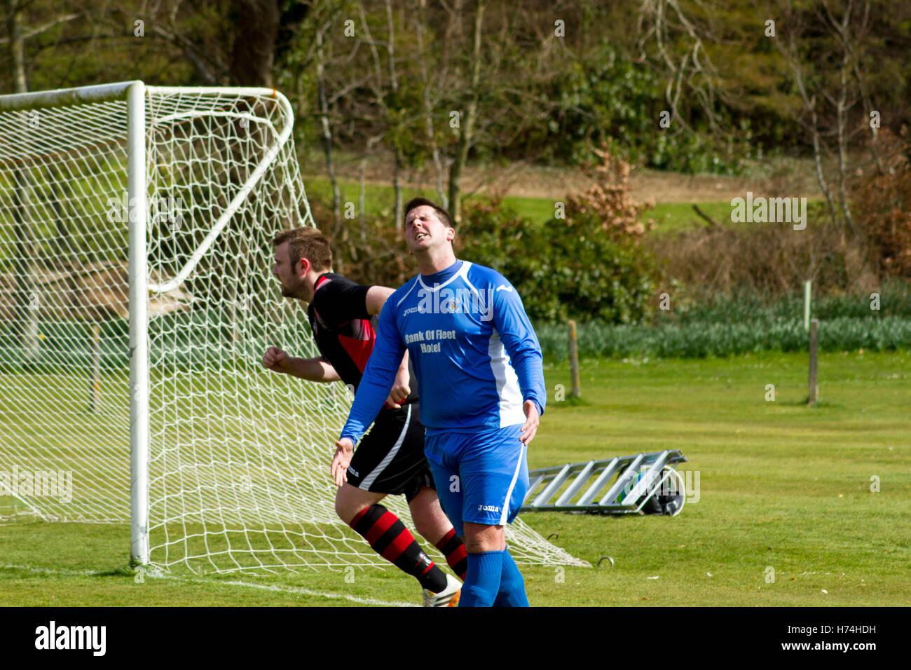 Footballers tackle hi-res stock photography and images - Alamy