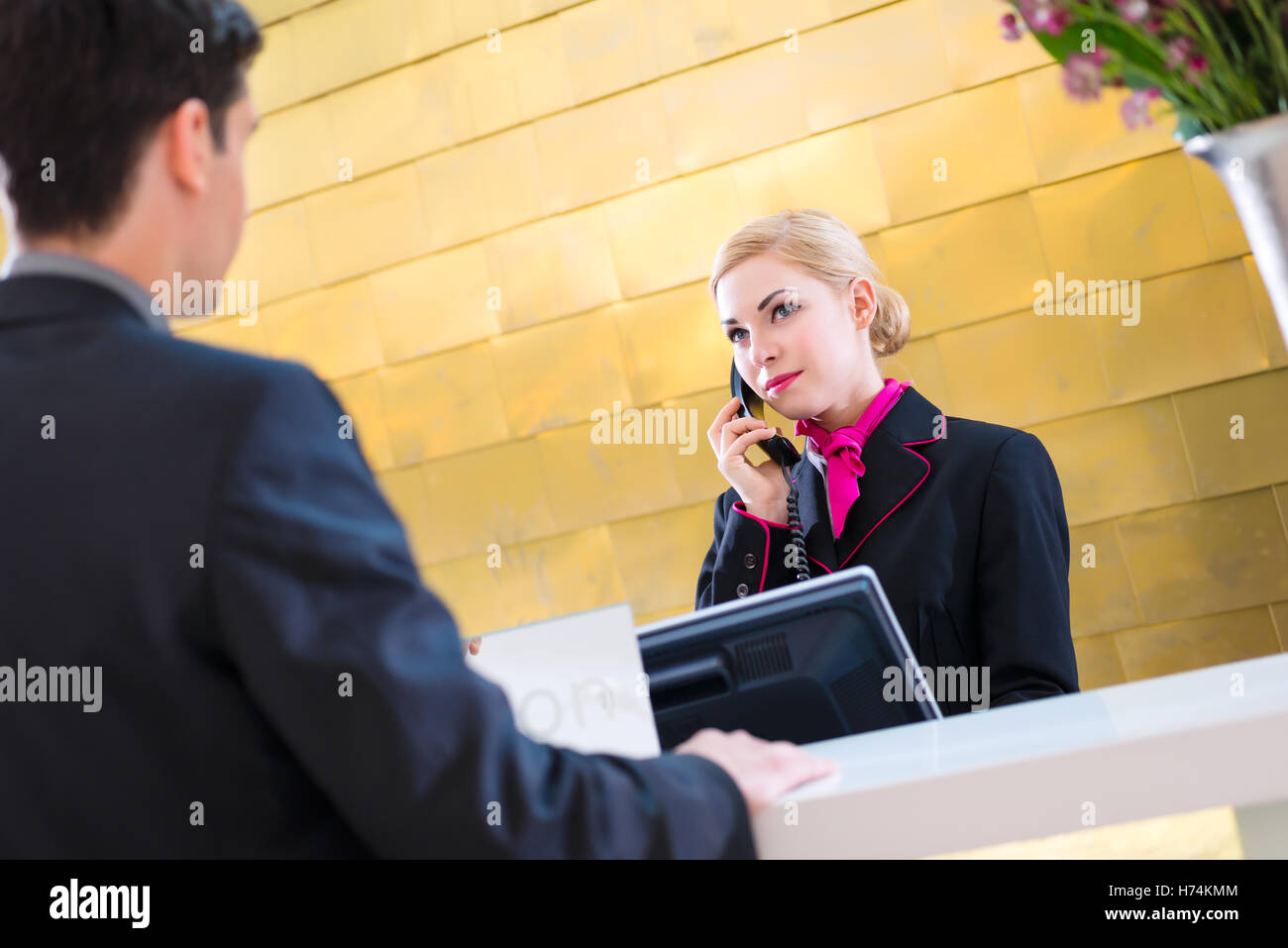 Hotel receptionist phone hi-res stock photography and images - Alamy