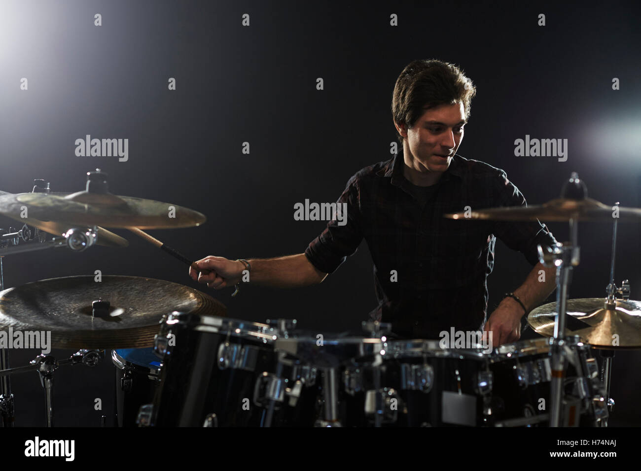 Young Drummer Playing Drum Kit In Studio Stock Photo - Alamy