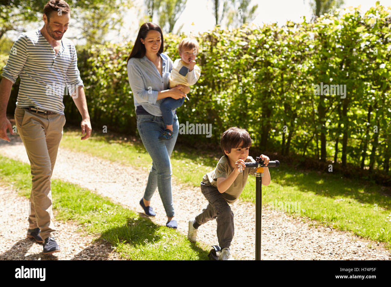 Family Going For Walk In Summer Countryside Stock Photo - Alamy
