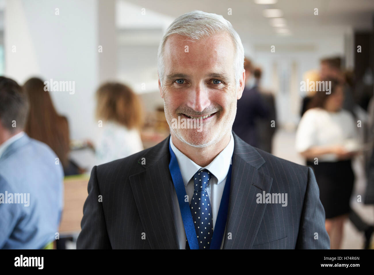 Portrait Of Male Delegate During Break At Conference Stock Photo - Alamy