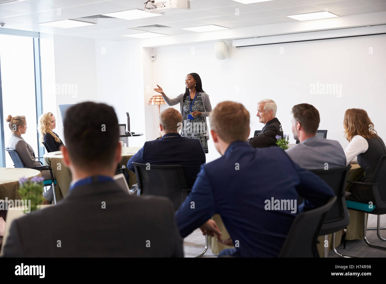 Businesswoman Making Presentation At Conference Stock Photo - Alamy