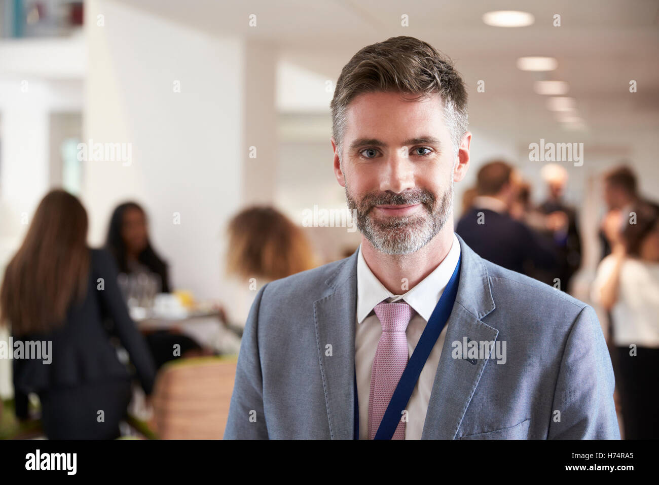 Delegate smiling hi-res stock photography and images - Alamy