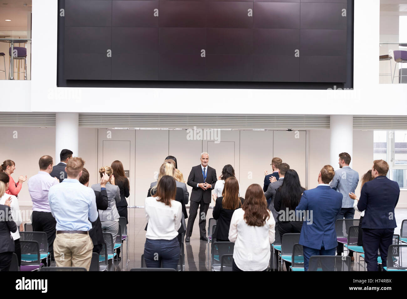 Mature Businessman Making Presentation At Conference Stock Photo - Alamy